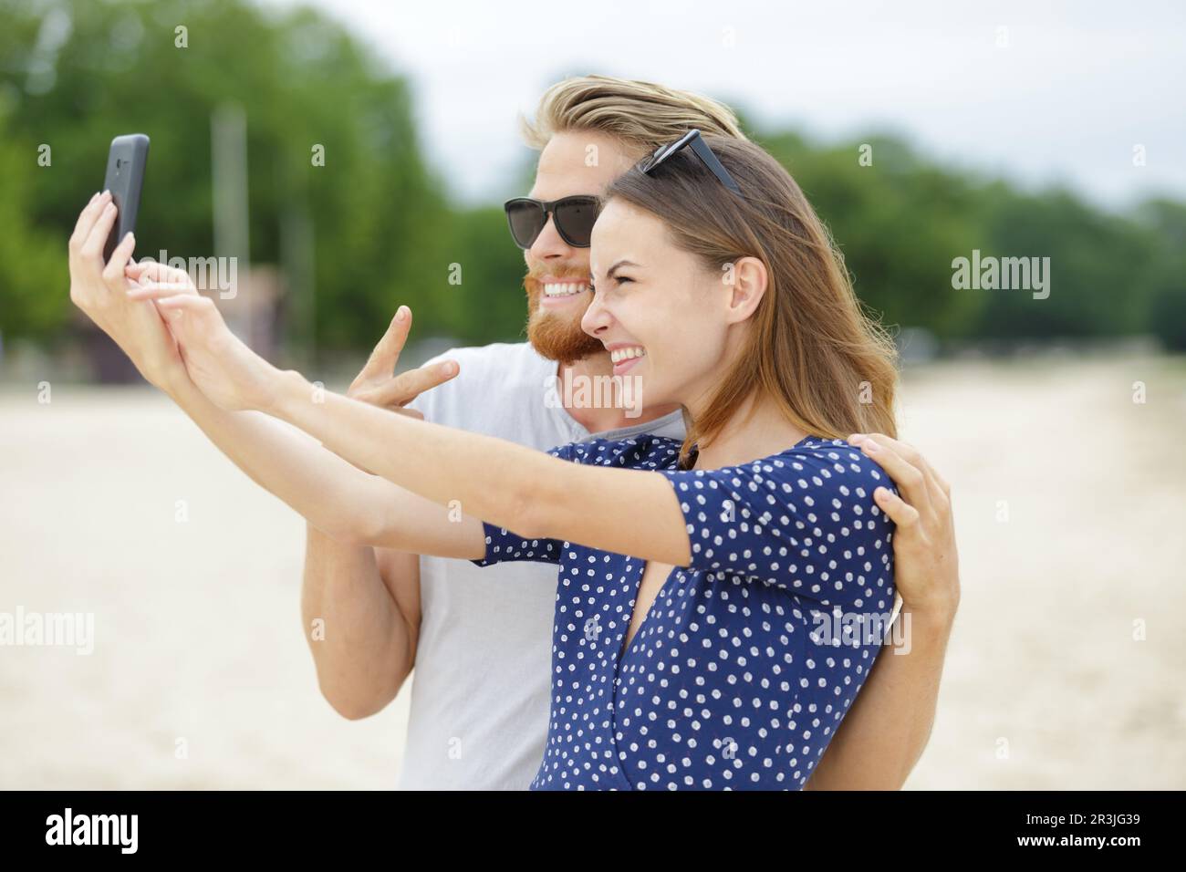 couple taking a wacky selfie Stock Photo - Alamy