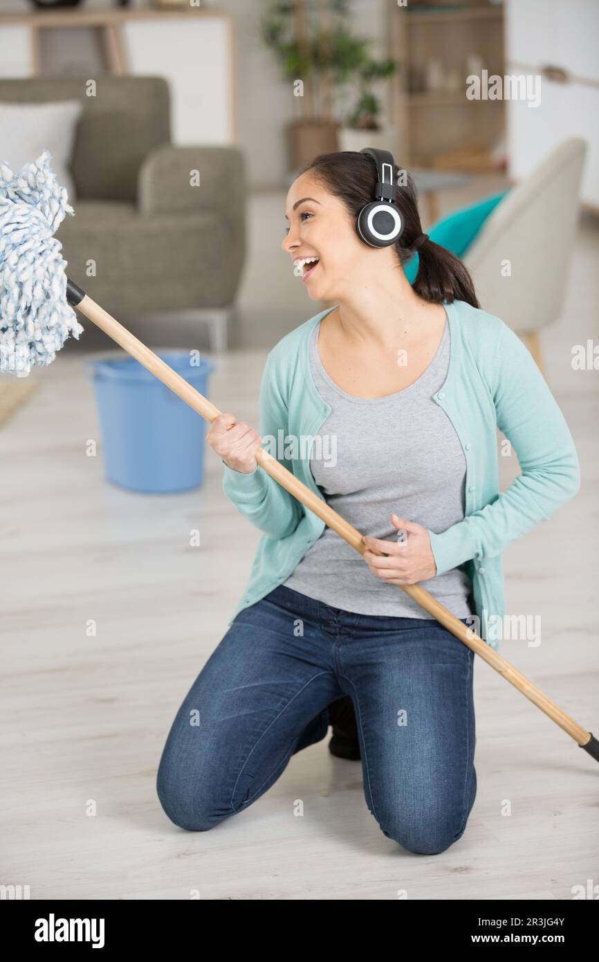 Woman cleaning home dancing vacuum hi-res stock photography and images ...