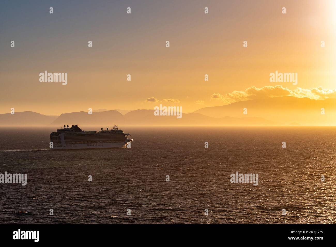 Cruise ship at sunset Stock Photo - Alamy