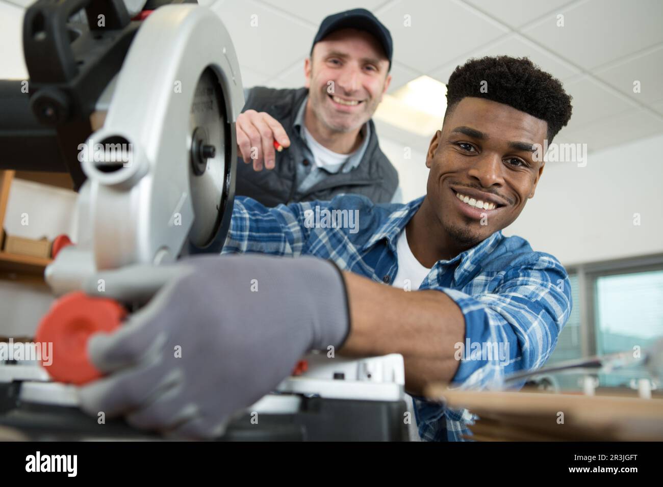 construction worker using circular saw Stock Photo - Alamy