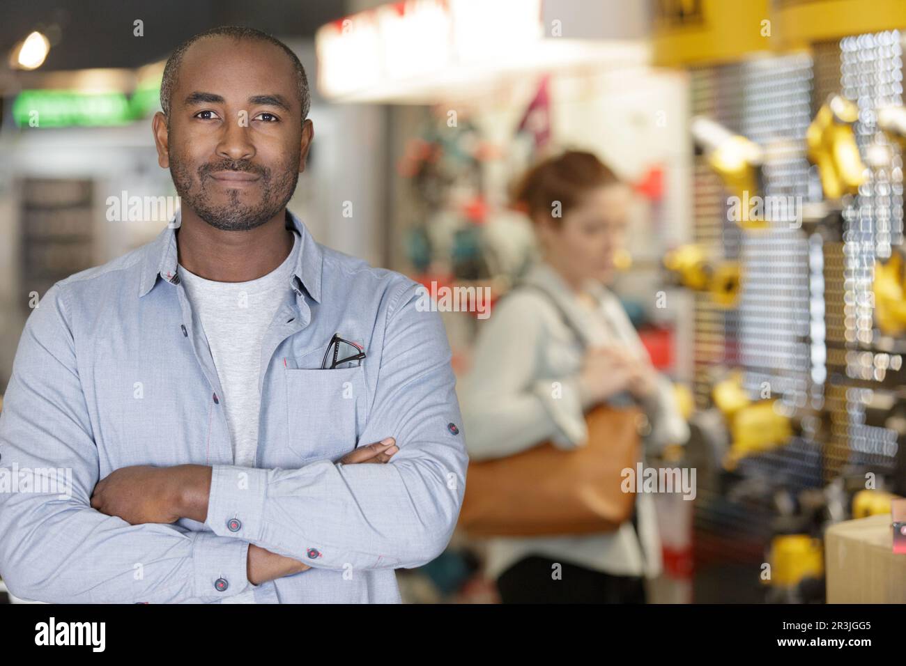 worker man in hardware store is trading sockets and switches Stock ...