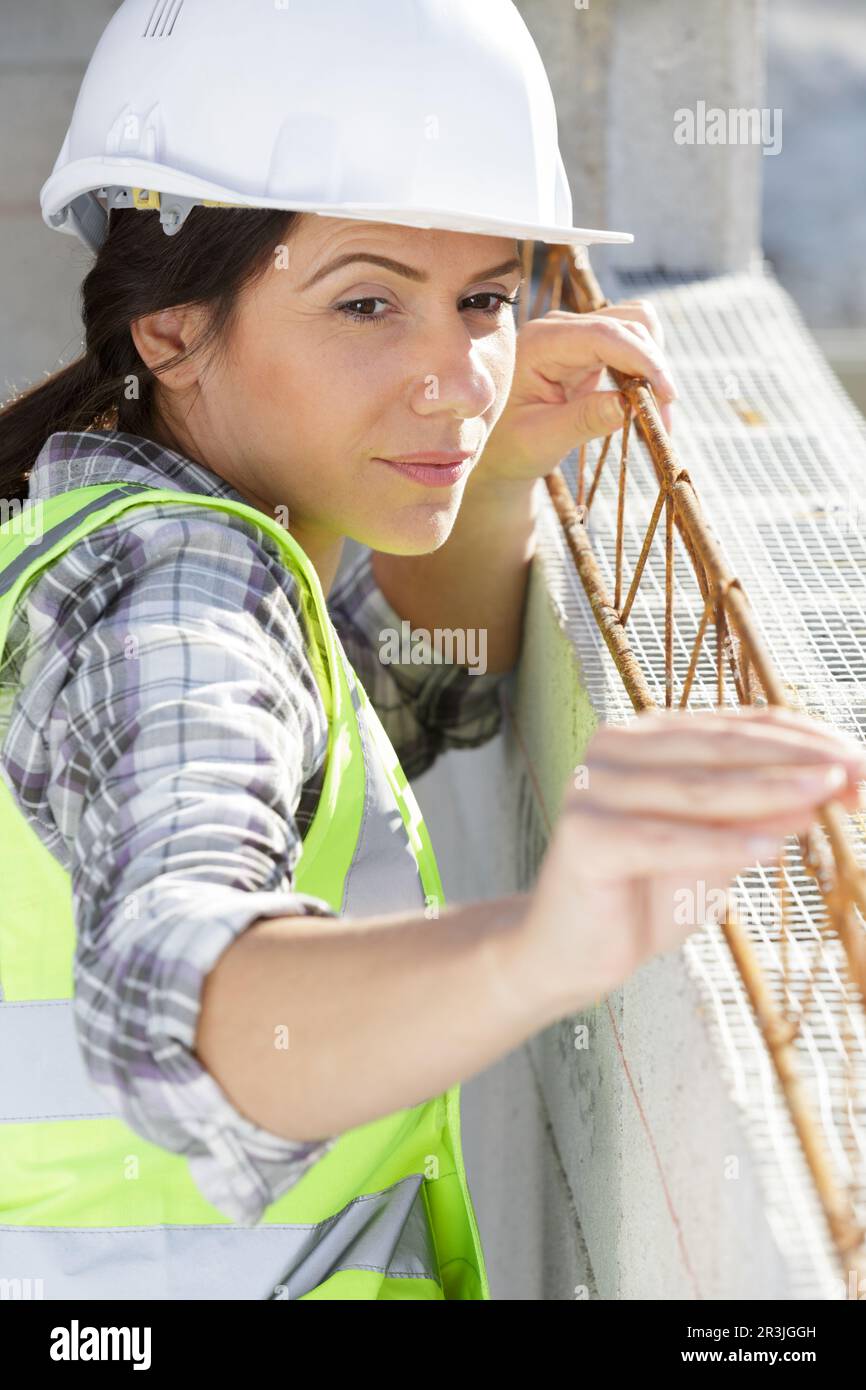 woman working on a wall construction Stock Photo - Alamy