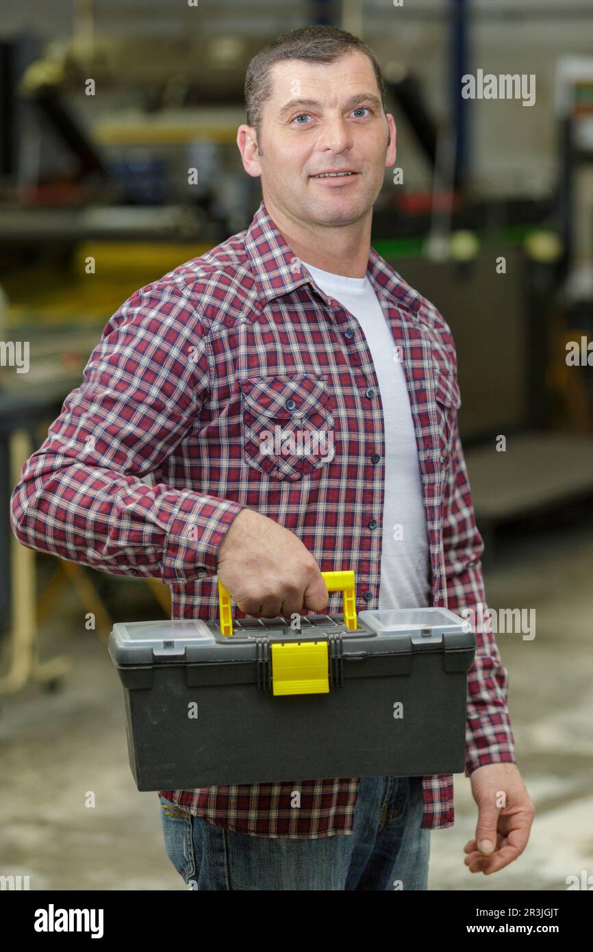 Carrying a toolbox hi-res stock photography and images - Alamy