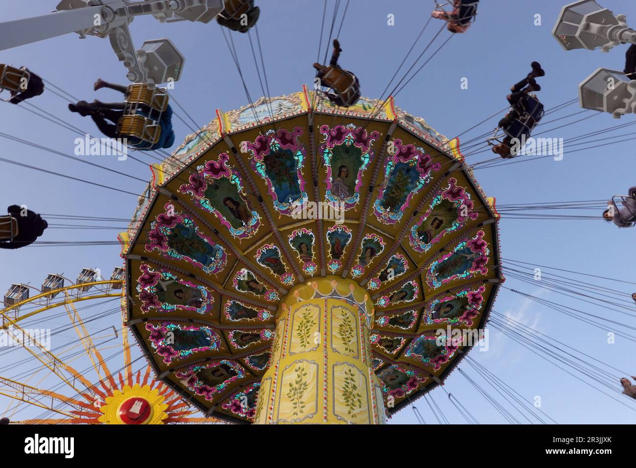 Chain carousel and Ferris wheel on the Hamburg Cathedral Stock Photo ...