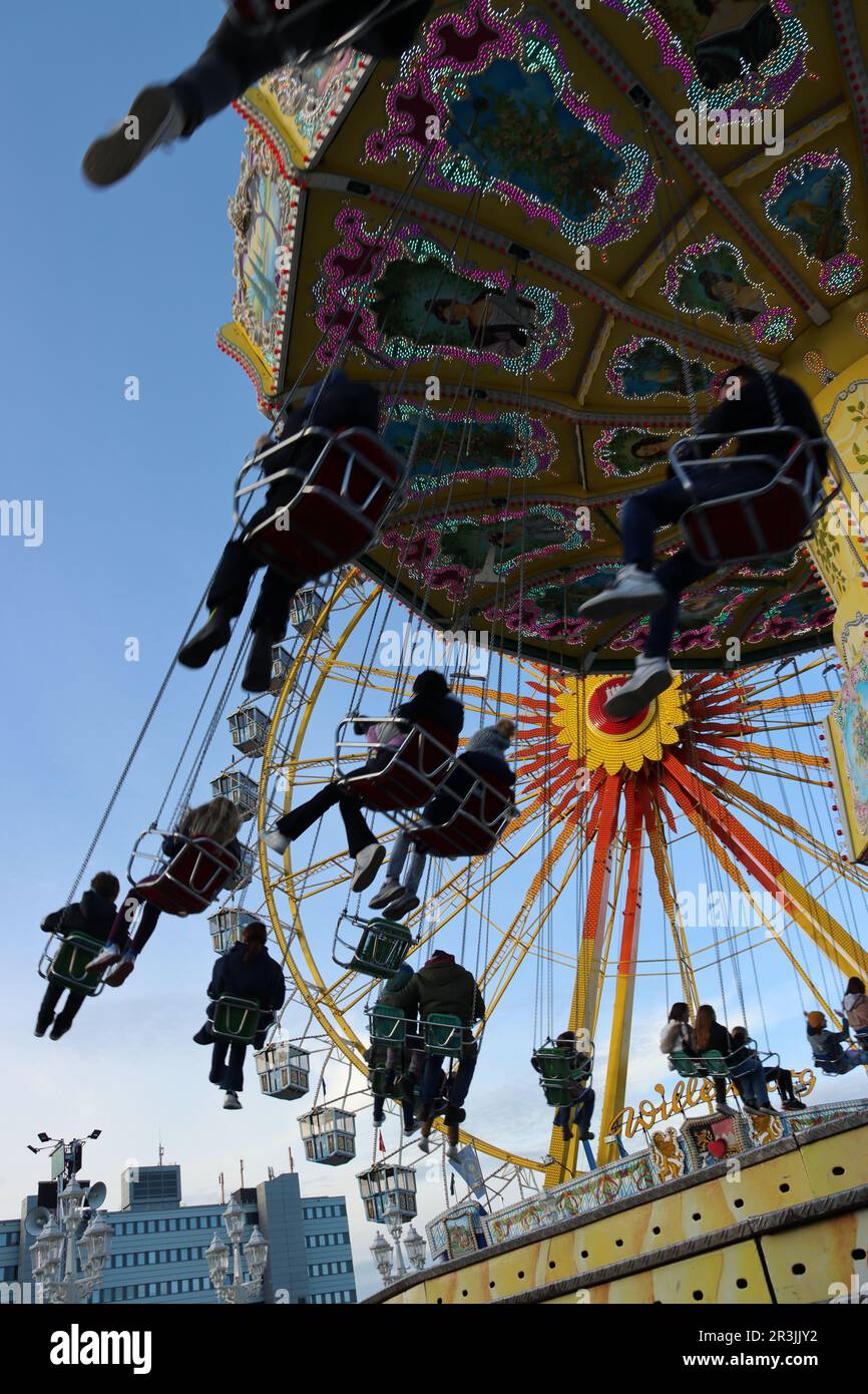 Chain carousel and Ferris wheel on the Hamburg Cathedral Stock Photo ...