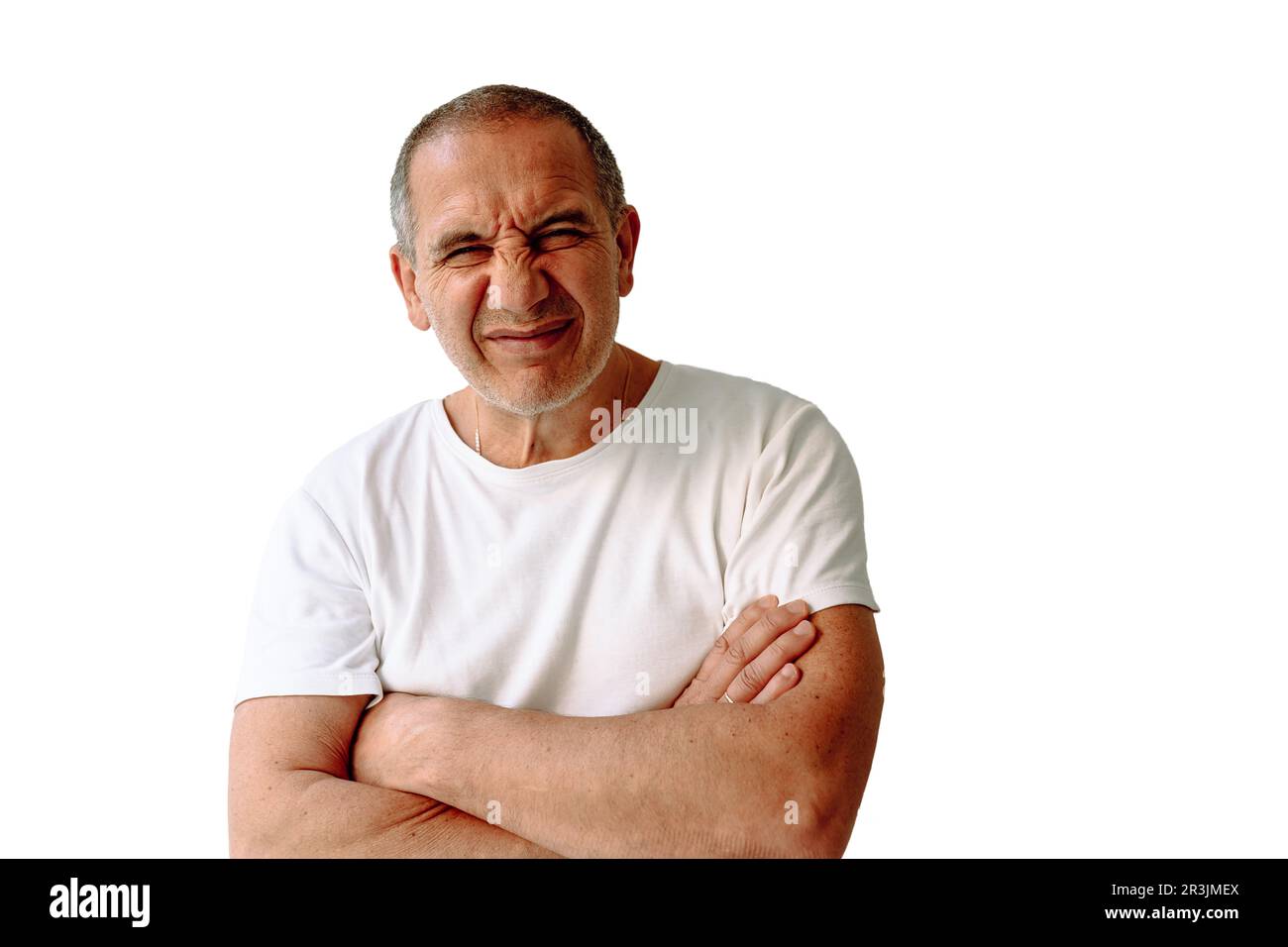 Portrait middle-aged man grimacing, with sly expression on face ...