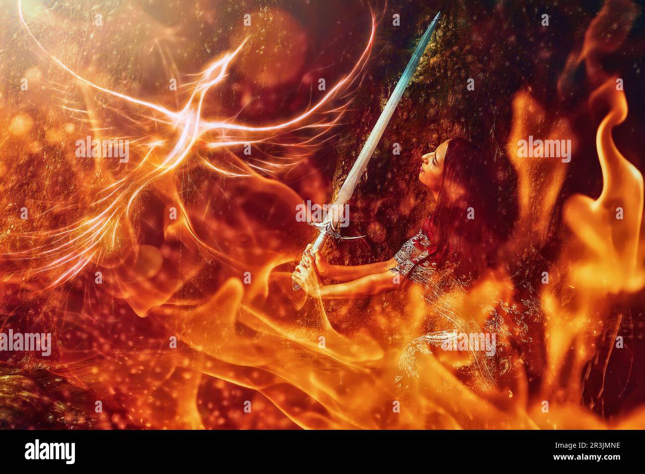Woman with sword on a beautiful fiery background with a phoenix Stock ...