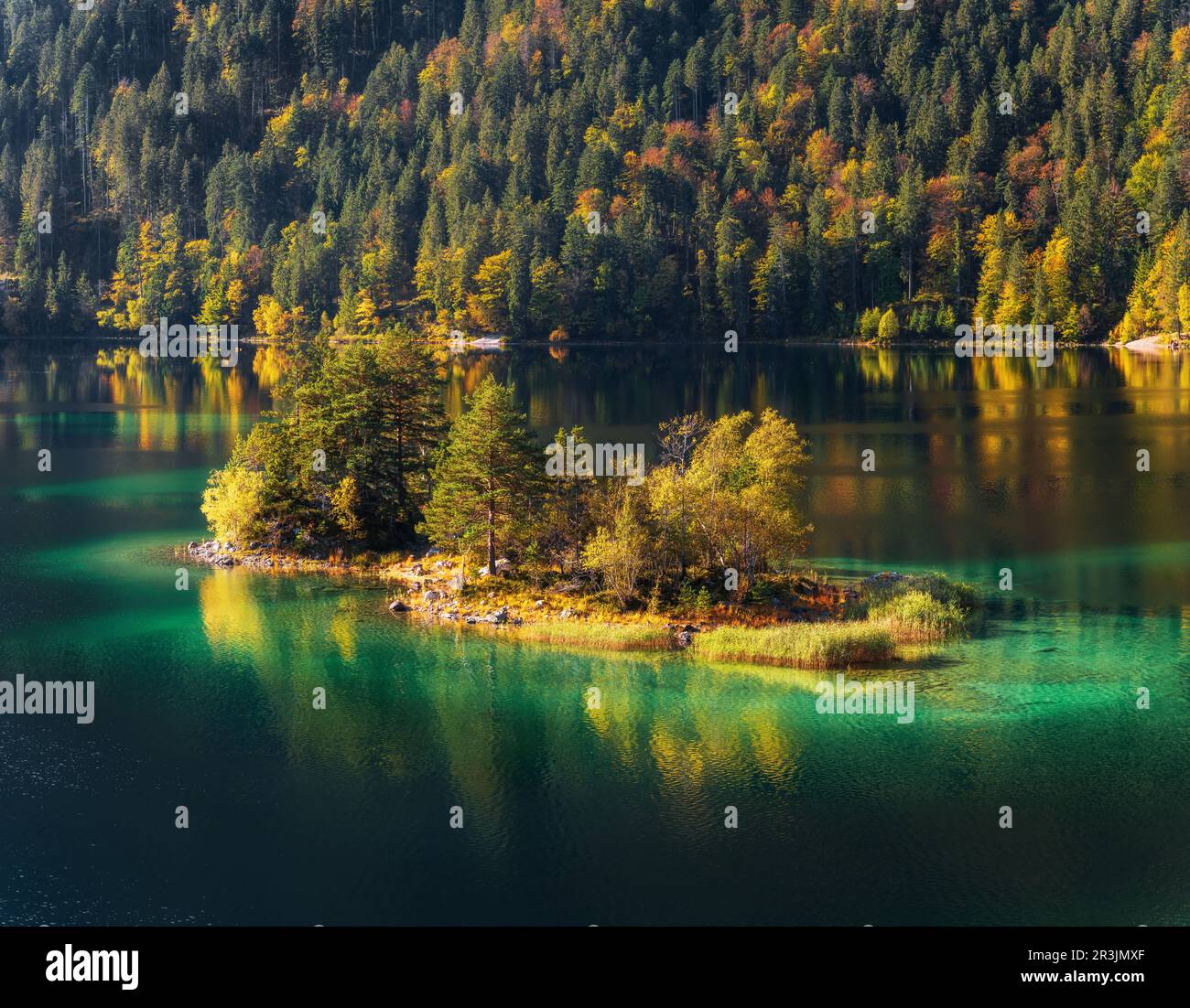 Lake Eibsee with a small island near mountain Zugspitze in south ...