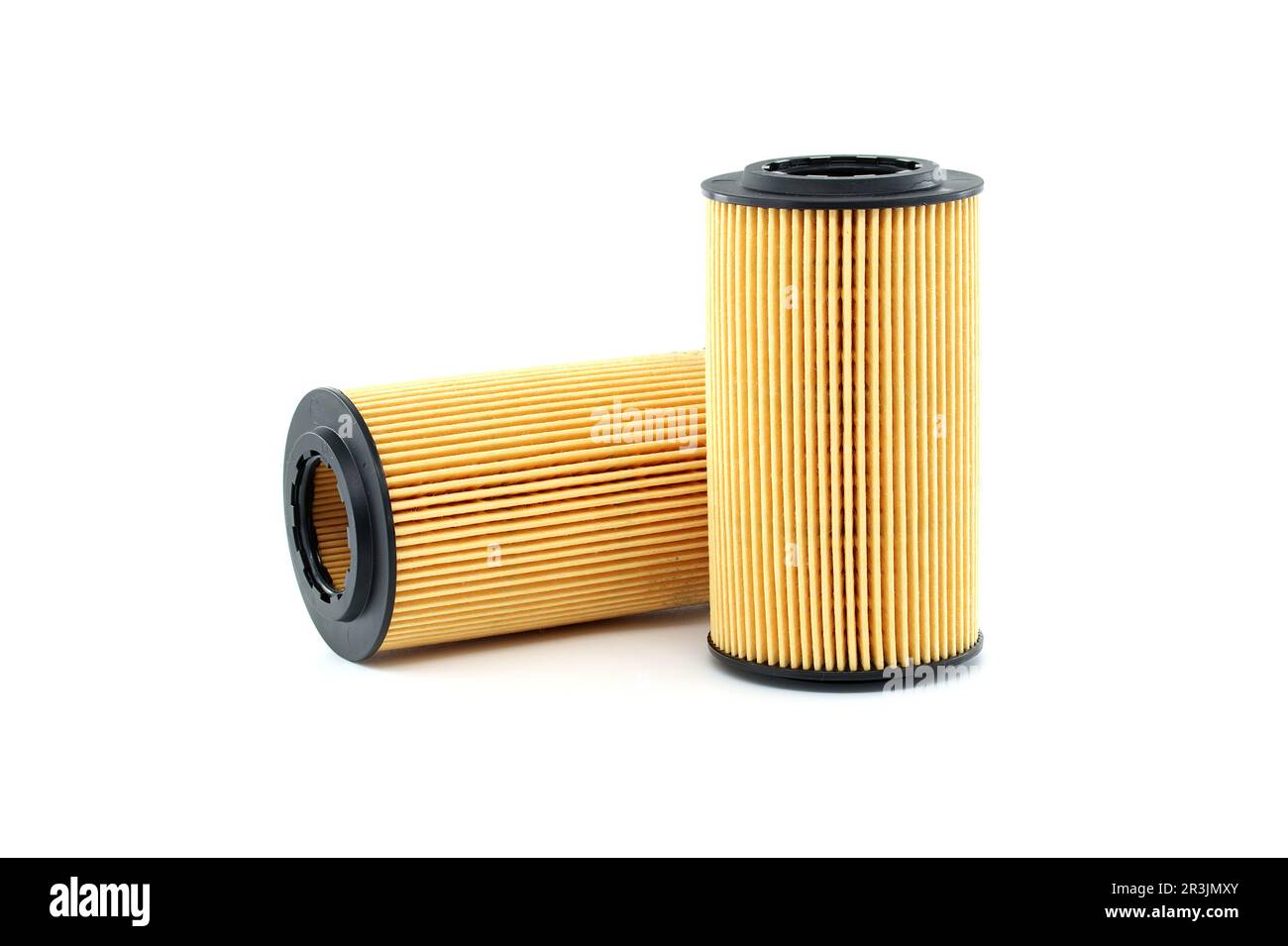 Selection of engine oil and air filter elements isolated on a white ...