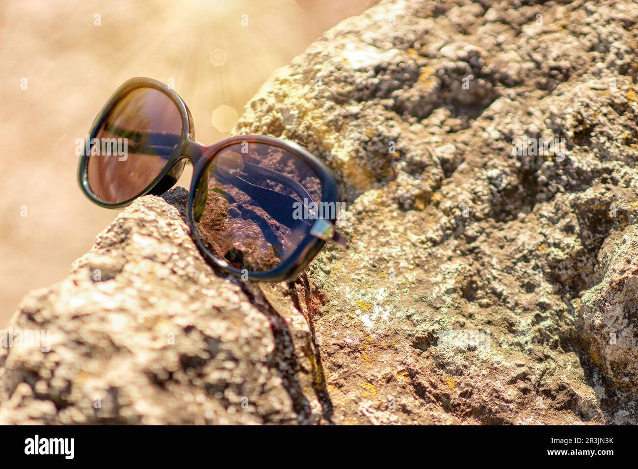 Sunglasses lie on rocks hi-res stock photography and images - Alamy