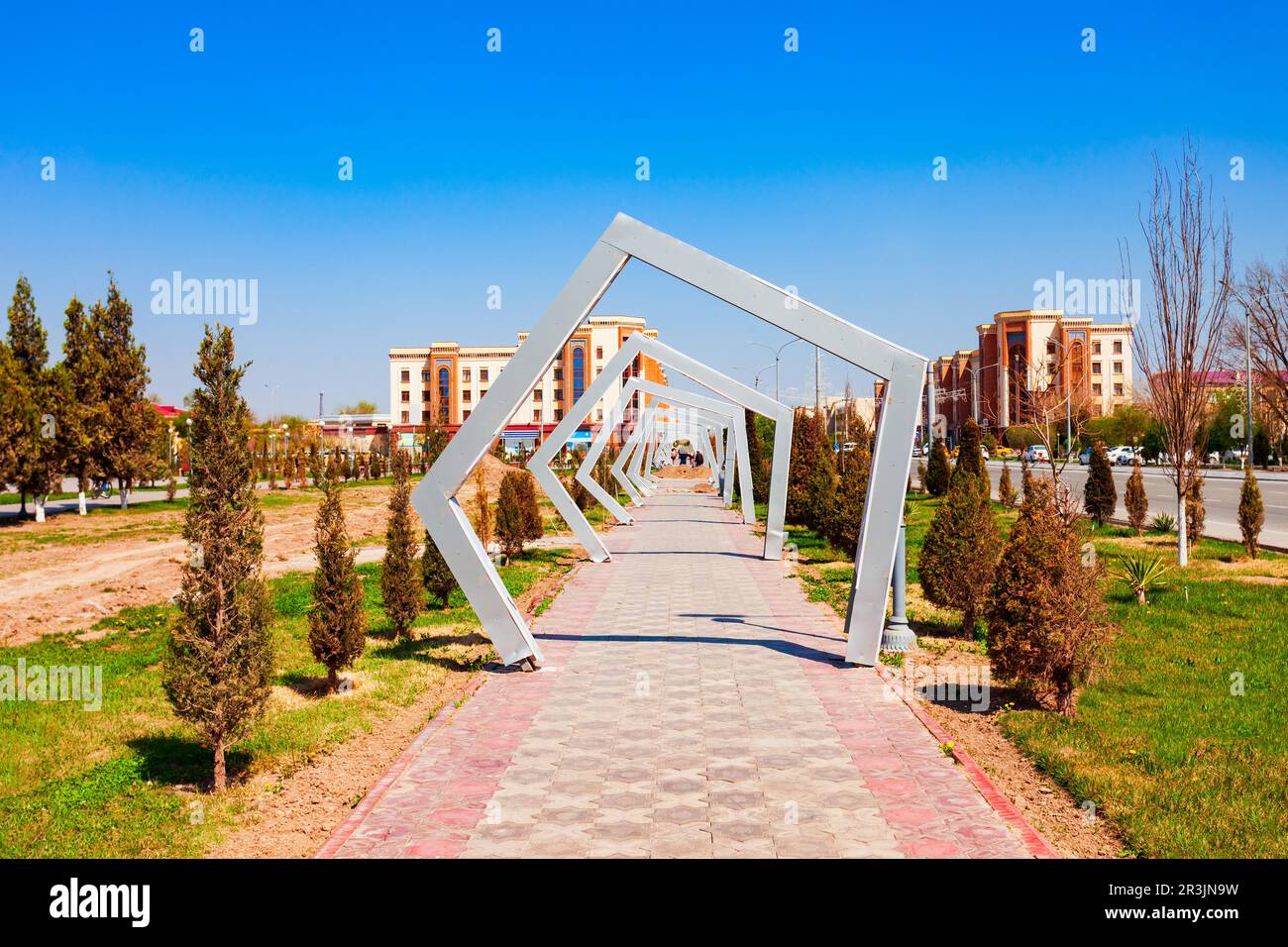 Pedesttian street and residential apartment building on background at ...