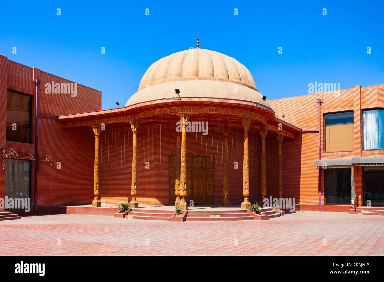Ancient rotunda with carving on wooden pillars in the centre of Urgench ...