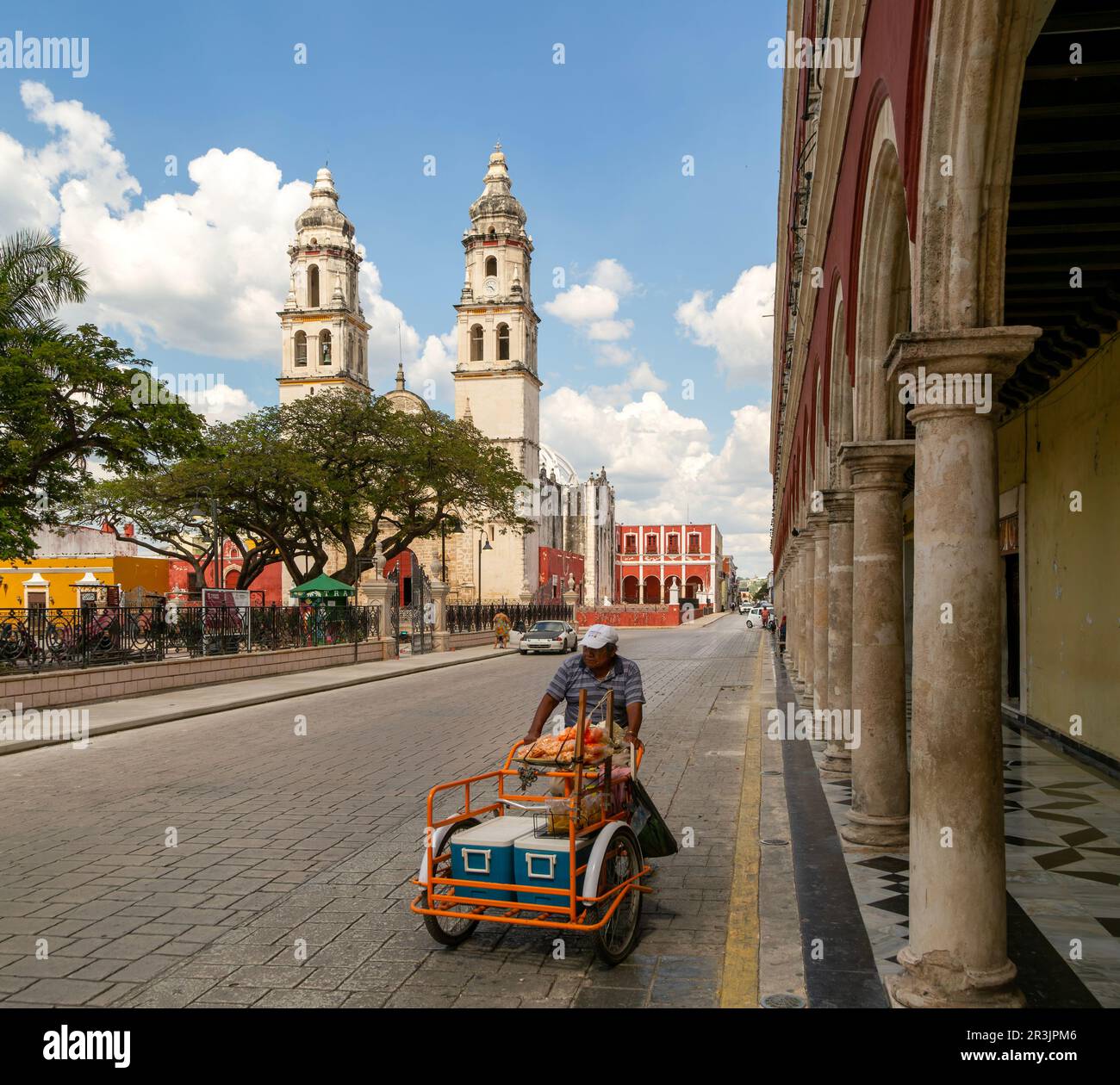 Man pushing cart in main square of Campeche city, Campeche State ...