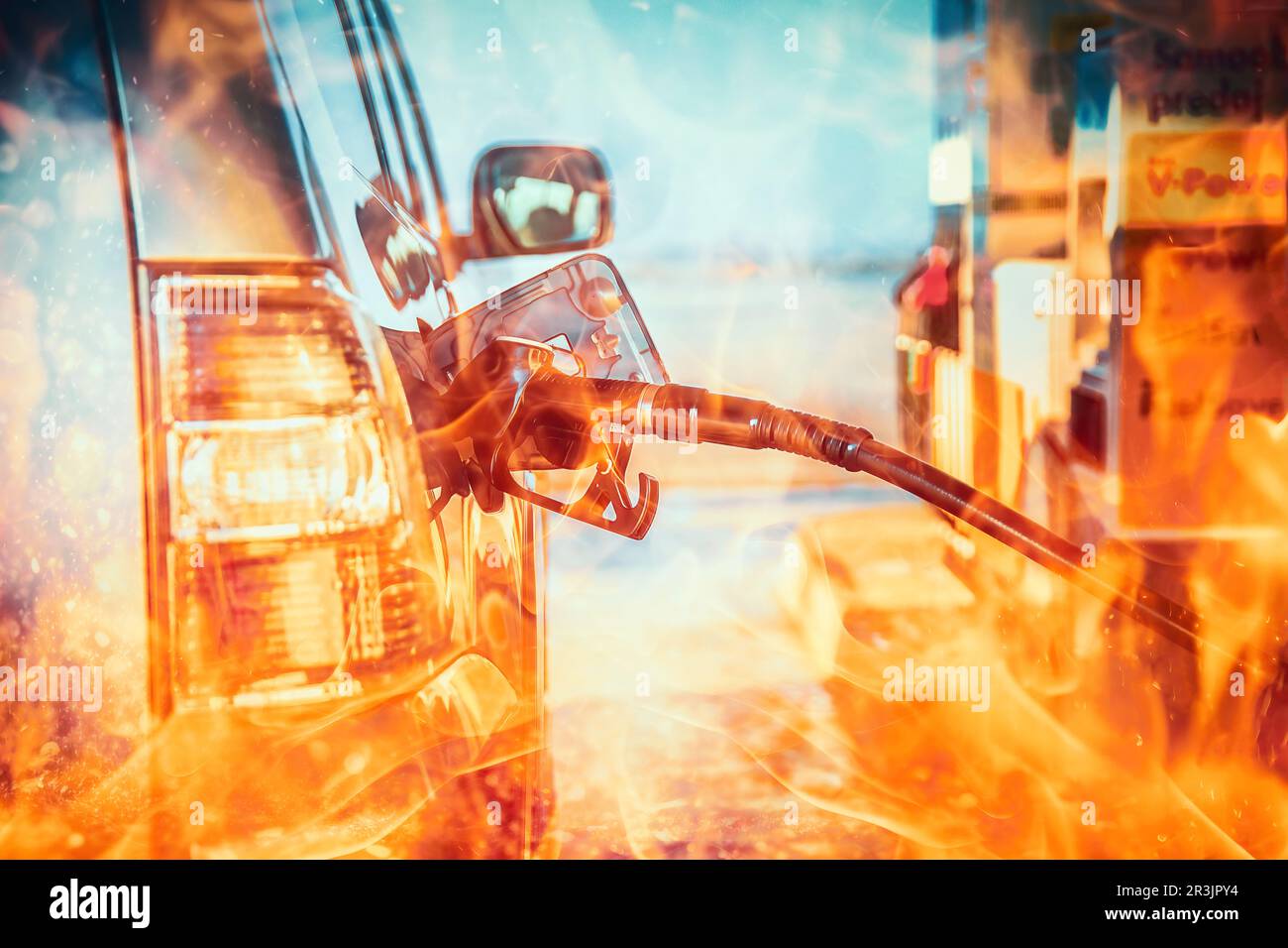 pumping gasoline fuel in a car at a gas station. Fire effect Stock ...