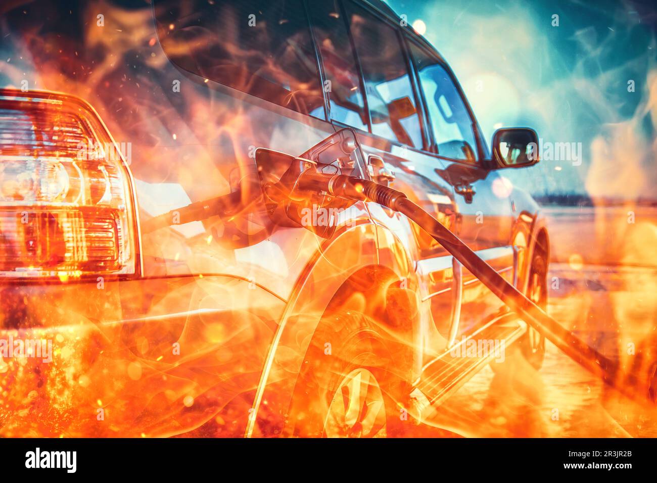 pumping gasoline fuel in a car at a gas station. Fire effect Stock ...