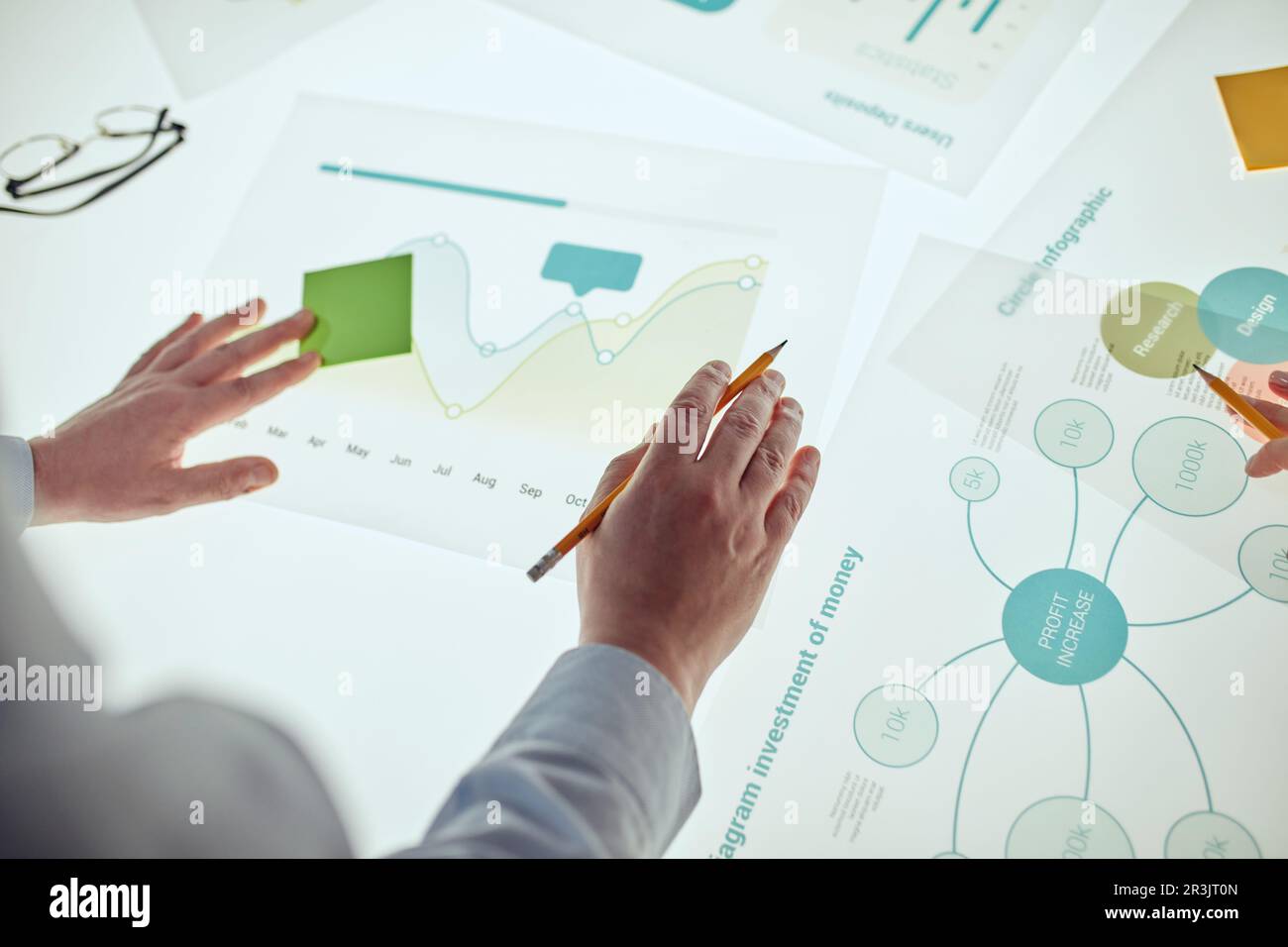 Close up image with one office worker, startup owner holding pencil and ...