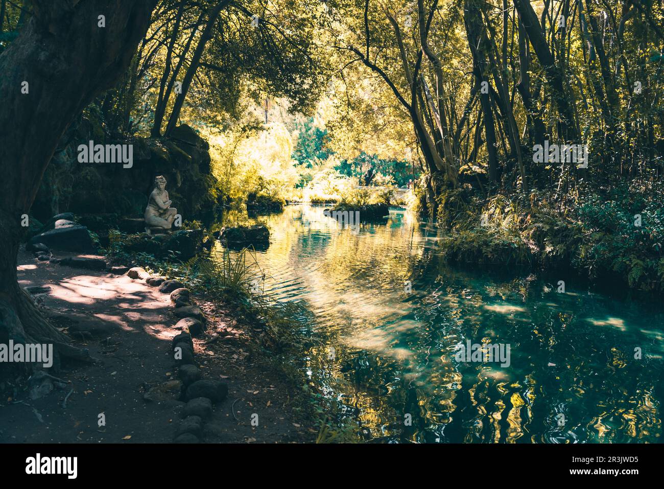 Stream in the secret garden Stock Photo - Alamy