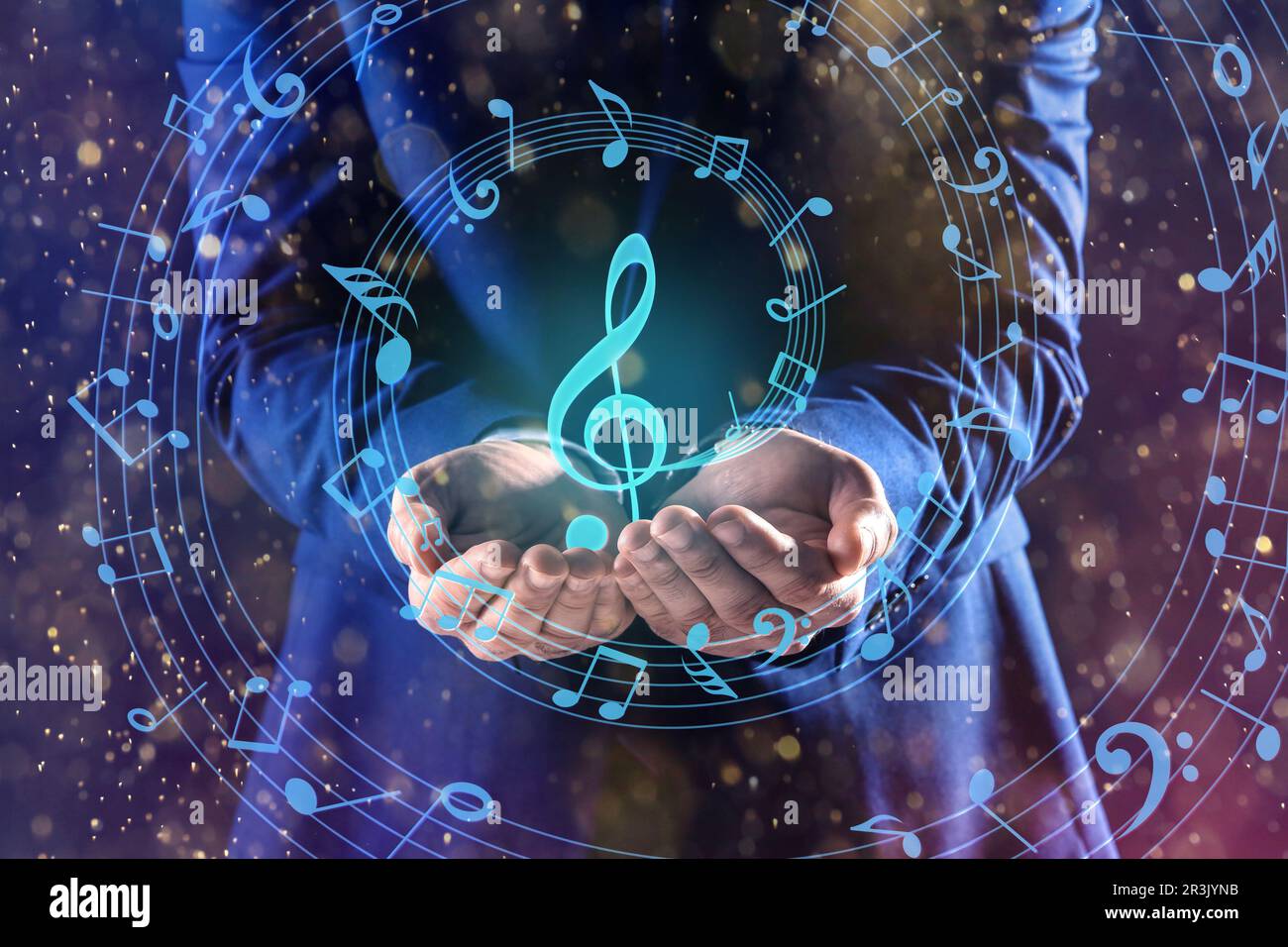Musician holding staff with music notes and symbols on color background ...