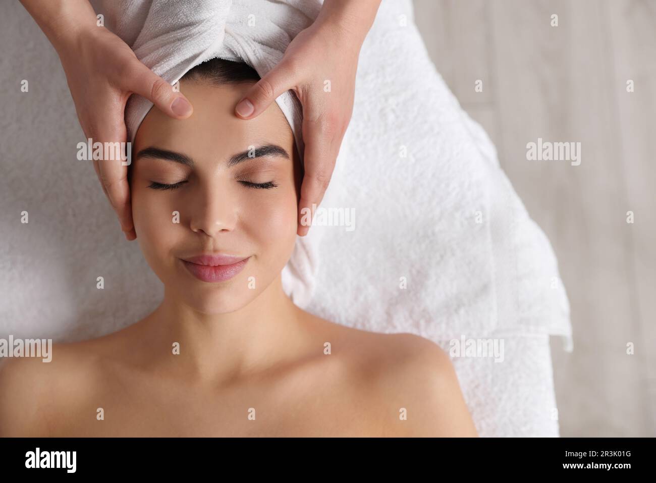 Beautiful Woman Receiving Facial Massage In Beauty Salon Closeup Top