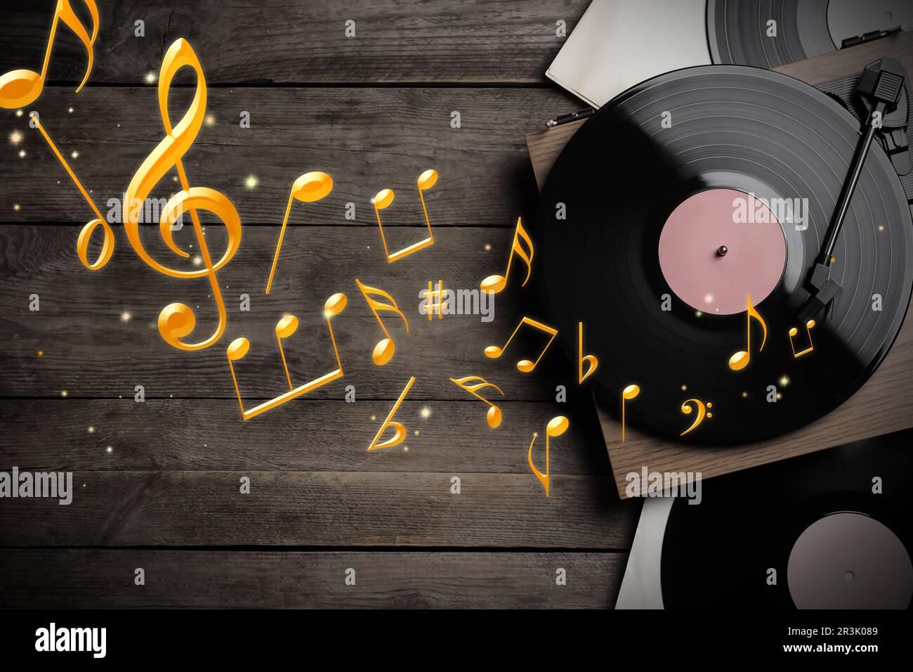 Music notes and other musical symbols flowing from over vinyl record ...