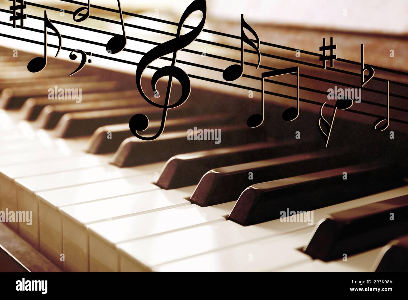 Staff with music notes and other musical symbols over piano, closeup ...