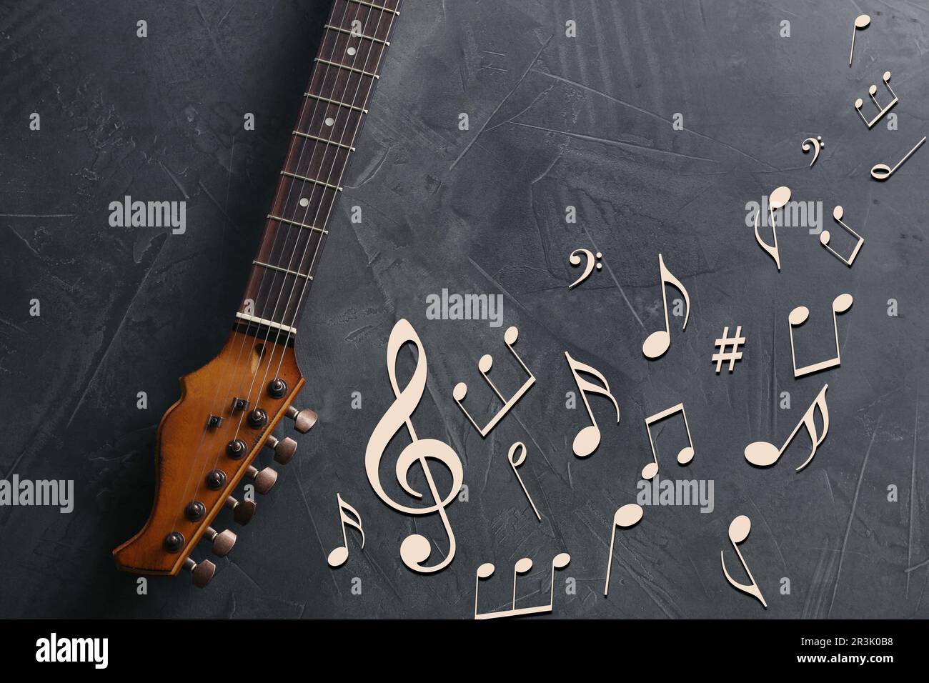 Guitar neck, music notes and symbols on grey background, top view Stock ...