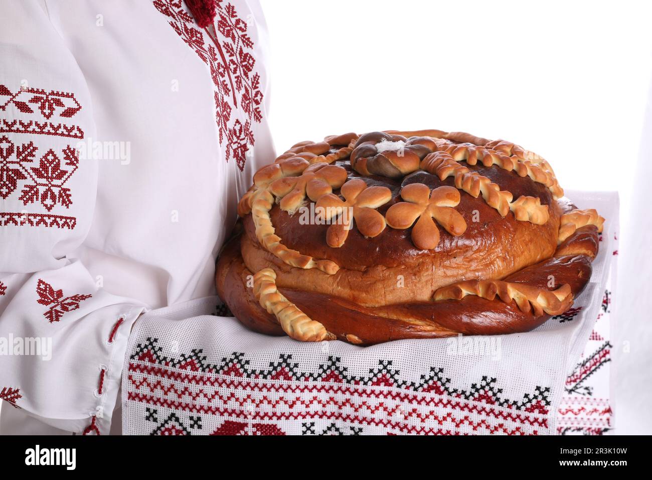 Woman with korovai on white background, closeup. Ukrainian bread and ...