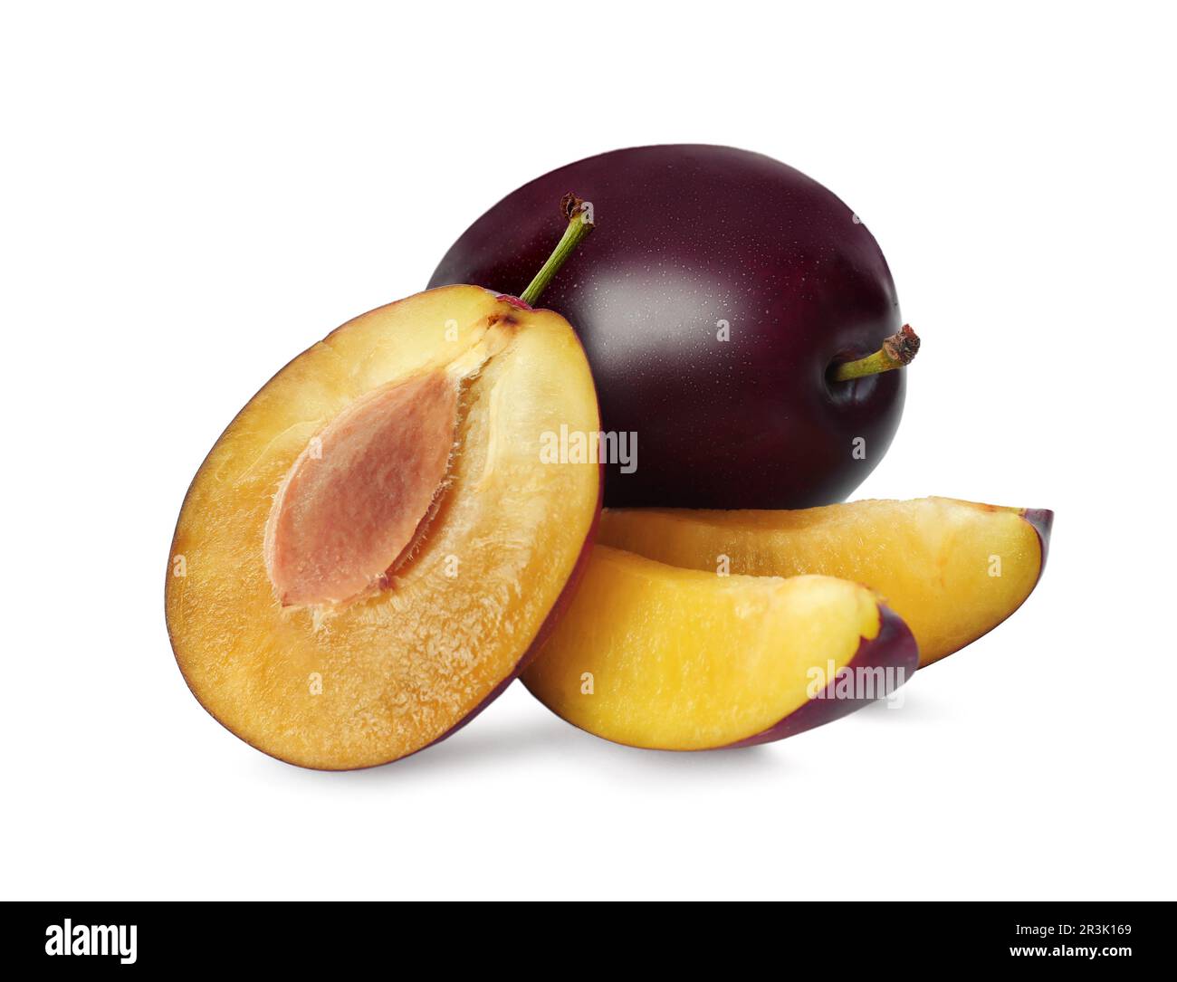 Whole and cut ripe plums on white background Stock Photo - Alamy