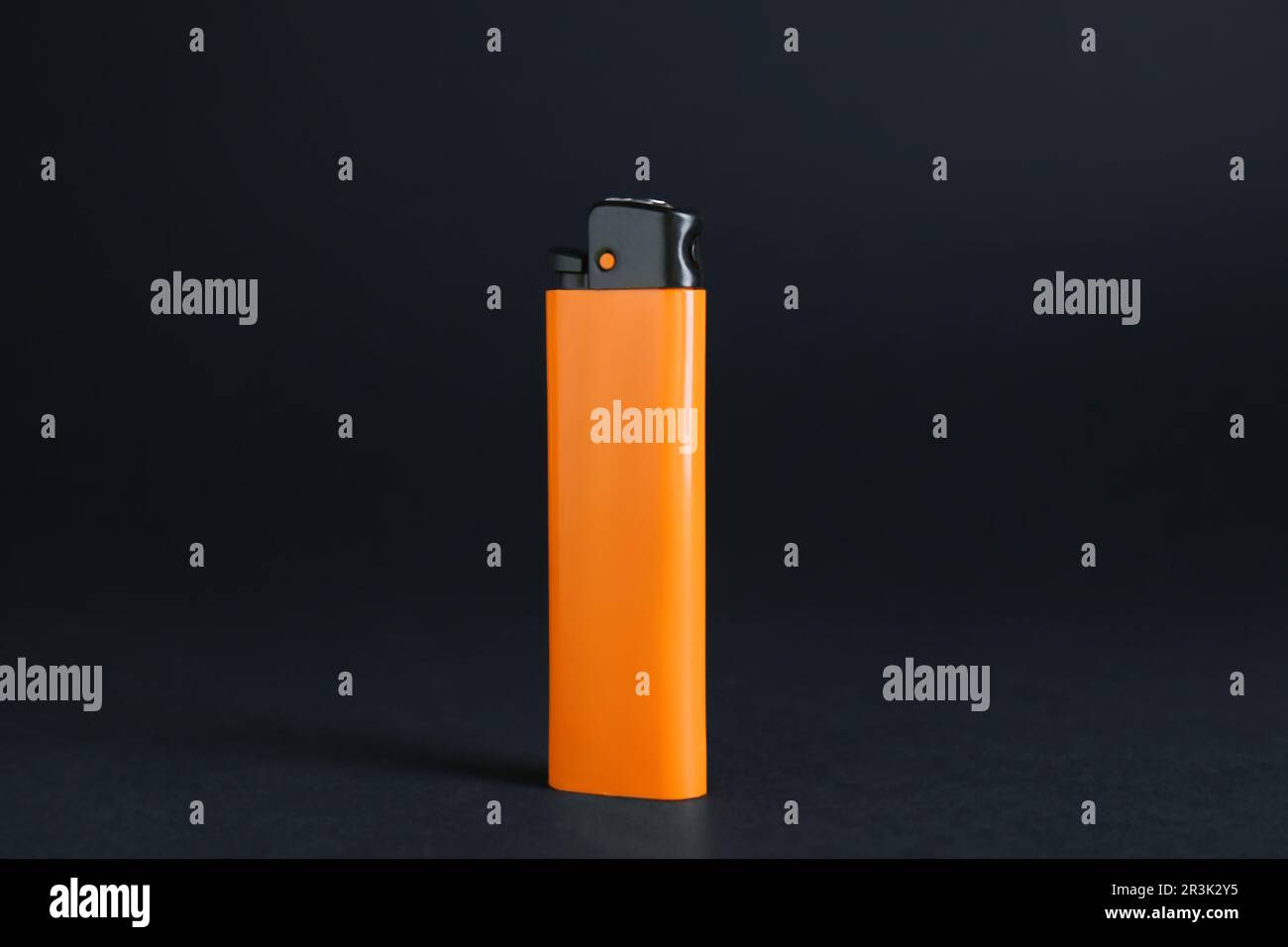Stylish small pocket lighter on black background Stock Photo - Alamy