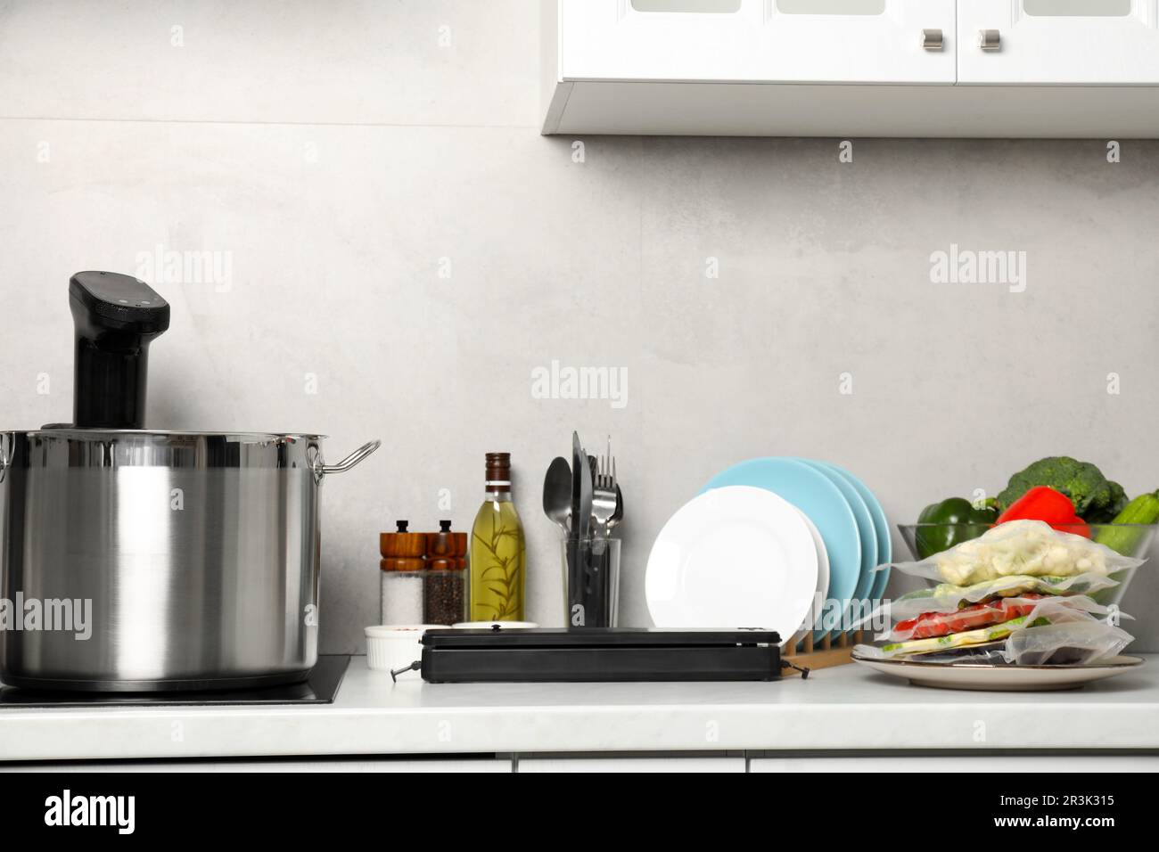 Pot with thermal immersion circulator, sealer and vacuum packed food ...