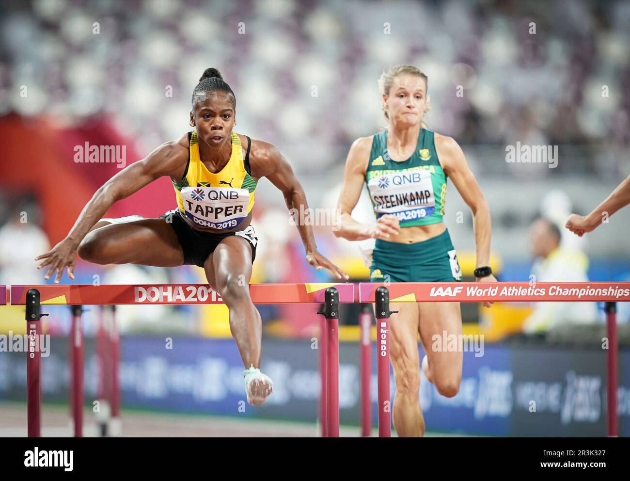 Megan Tapper running the 100m hurdles at the 2019 World Athletics ...