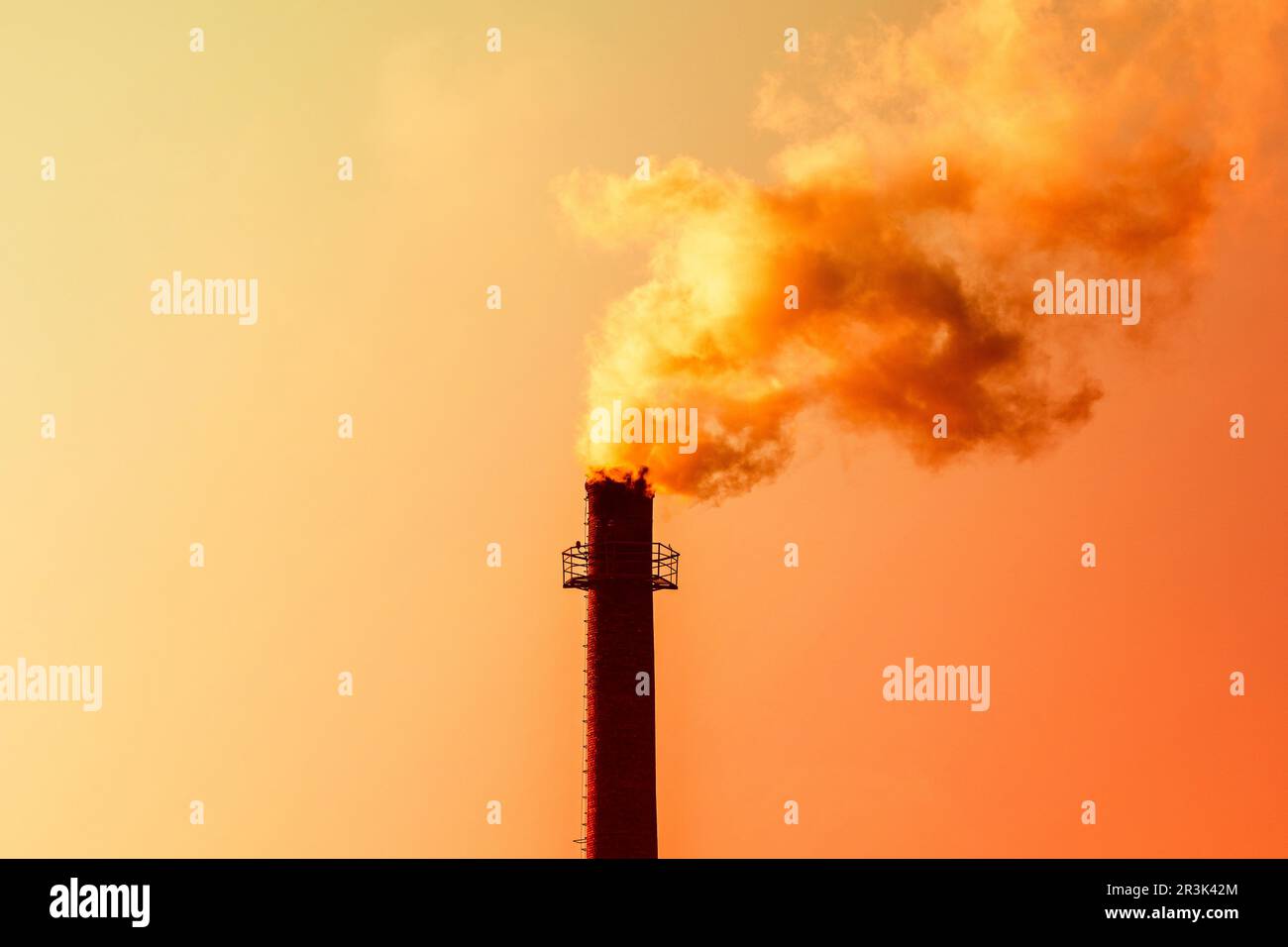 Factory chimney blowing smoke from pipe in evening sky background Stock ...