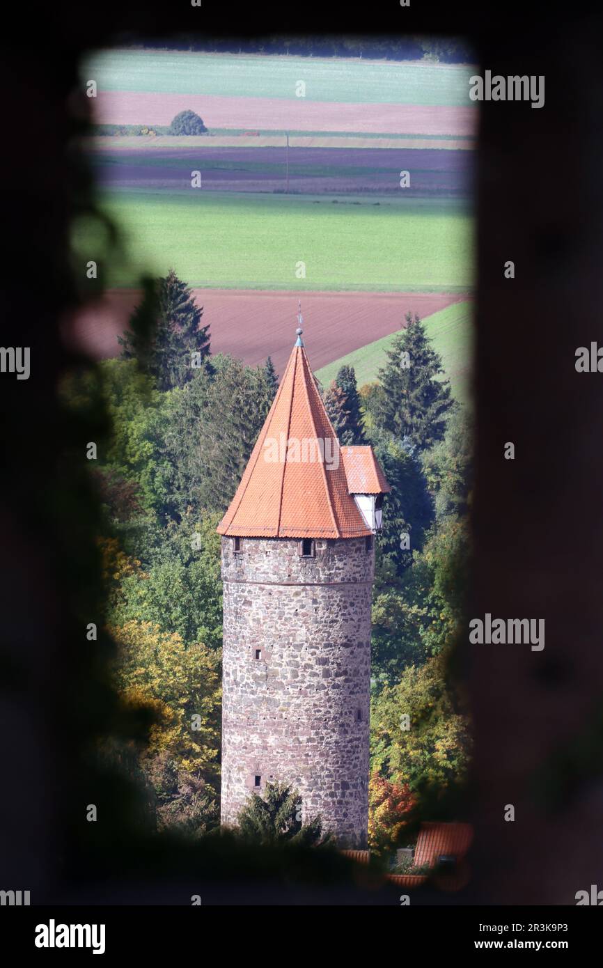 View from the castle ruins through an embrasure to a tower of the ...