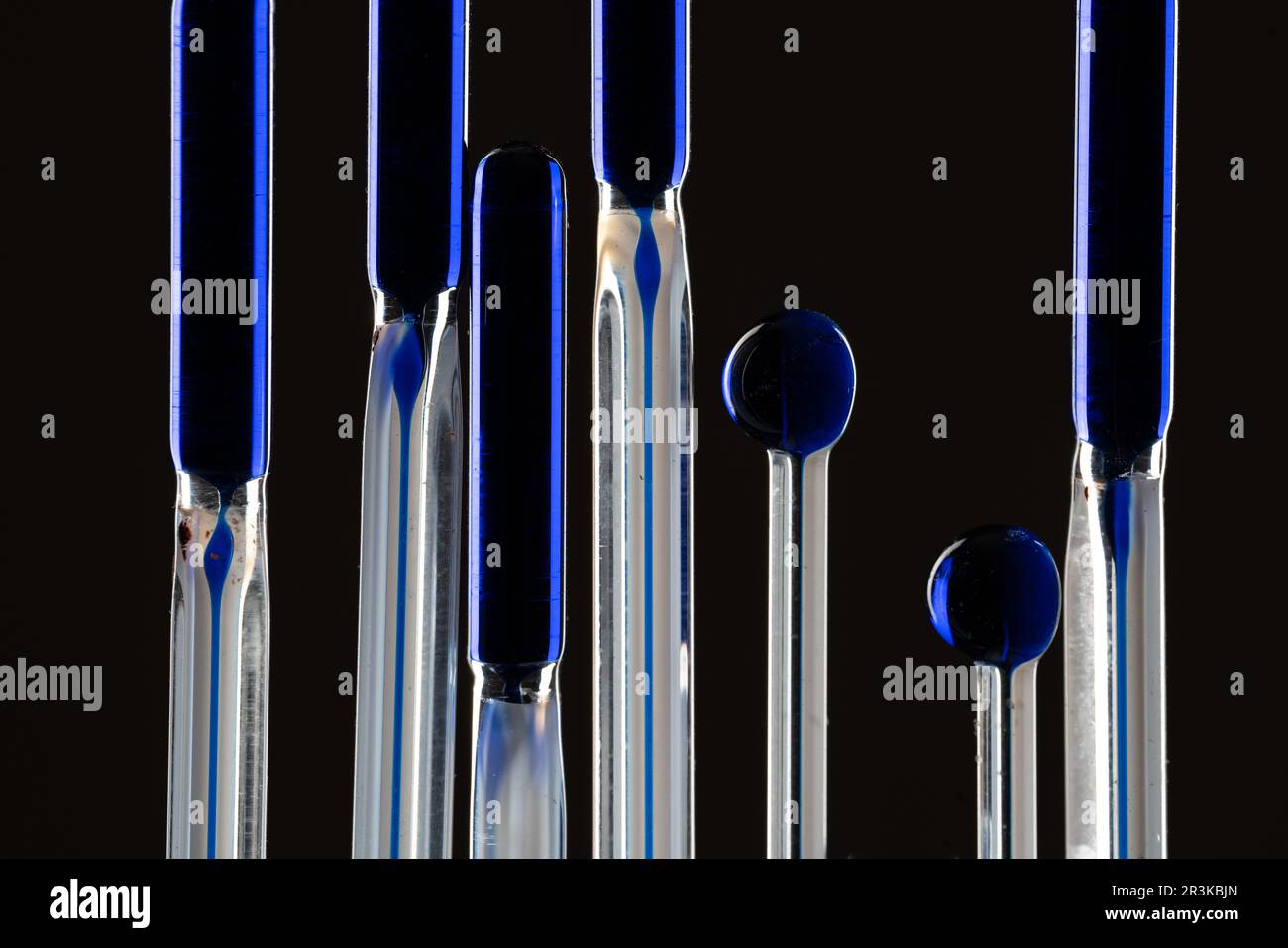 Thermometer capillary against black background Stock Photo - Alamy
