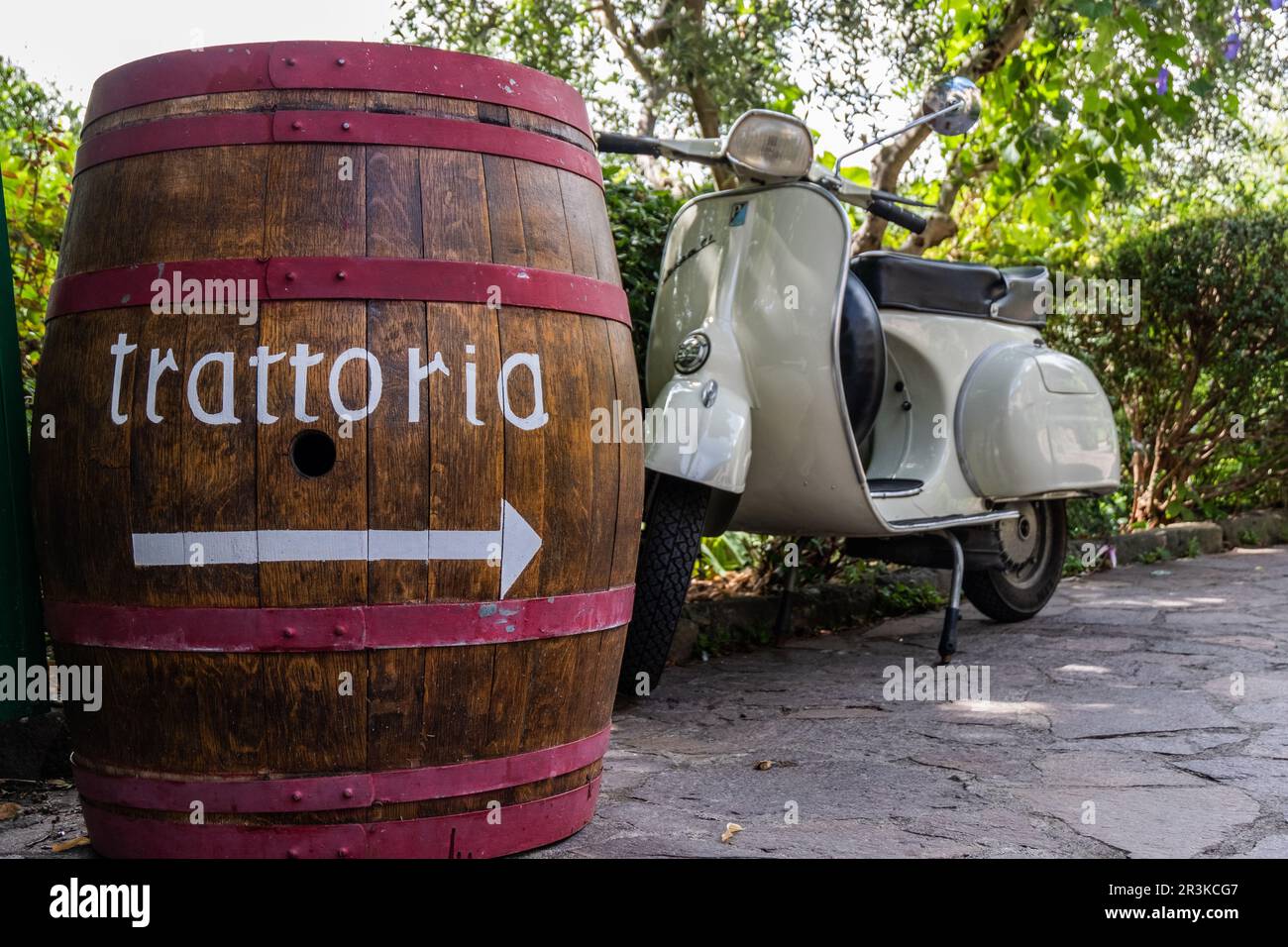 An antique Chianti wine barrel and a vespa scooter Stock Photo - Alamy