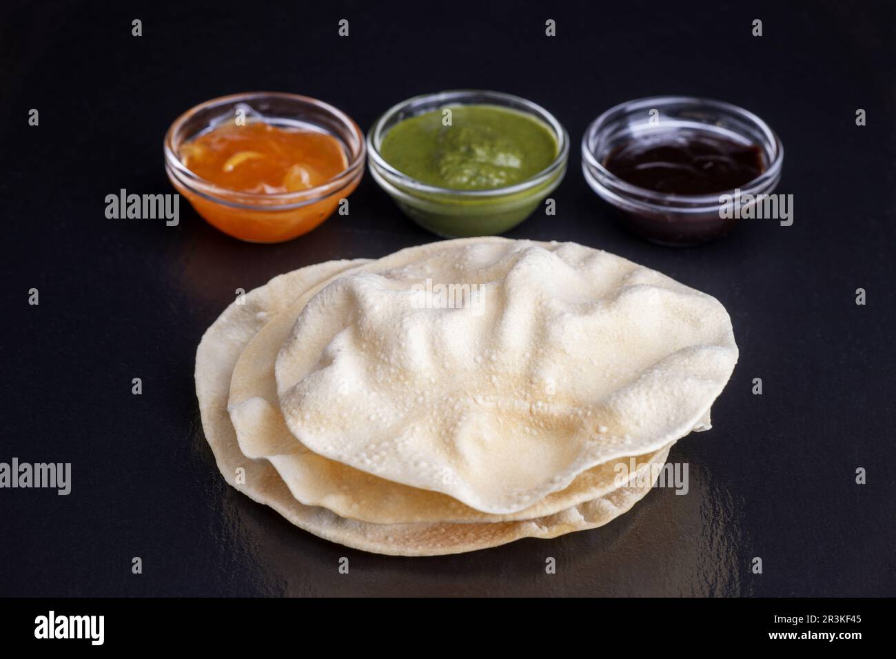 Papadam with various Indian sauces Stock Photo - Alamy