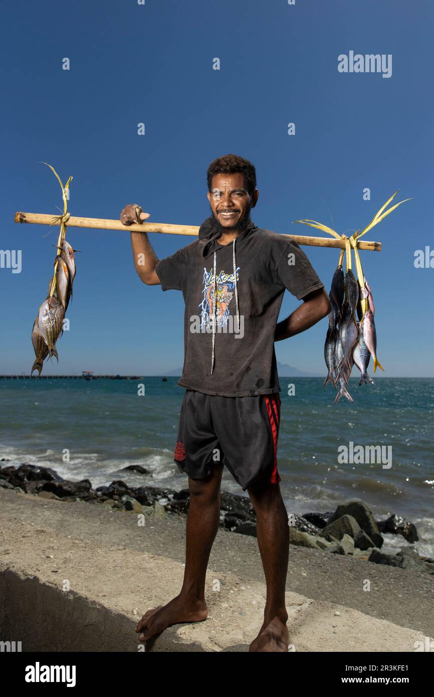 Fisherman selling fish in Dili, Timor-Leste Stock Photo - Alamy