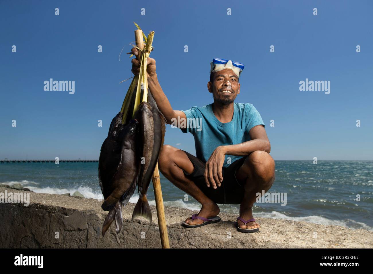 Fisherman selling fish in Dili, Timor-Leste Stock Photo - Alamy