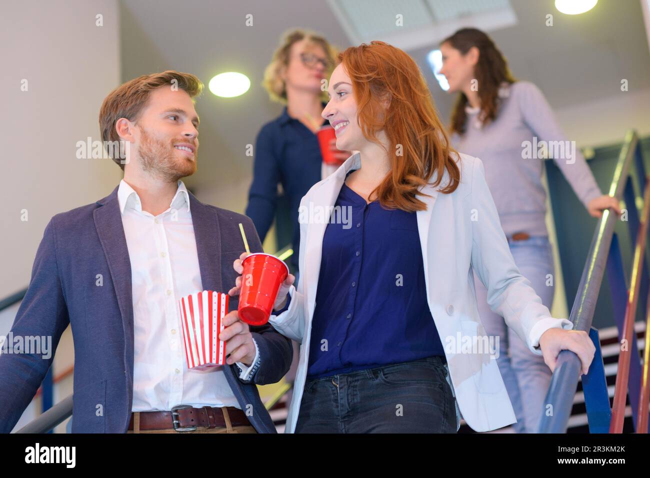crowd going down on staircase exit Stock Photo - Alamy