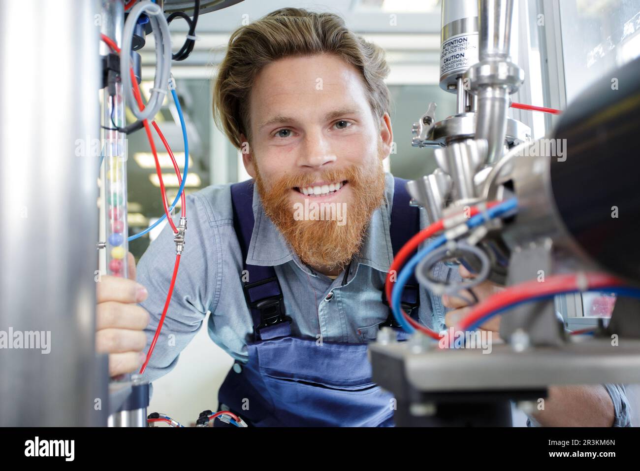 self portrait of attractive joyful man holding cables Stock Photo - Alamy