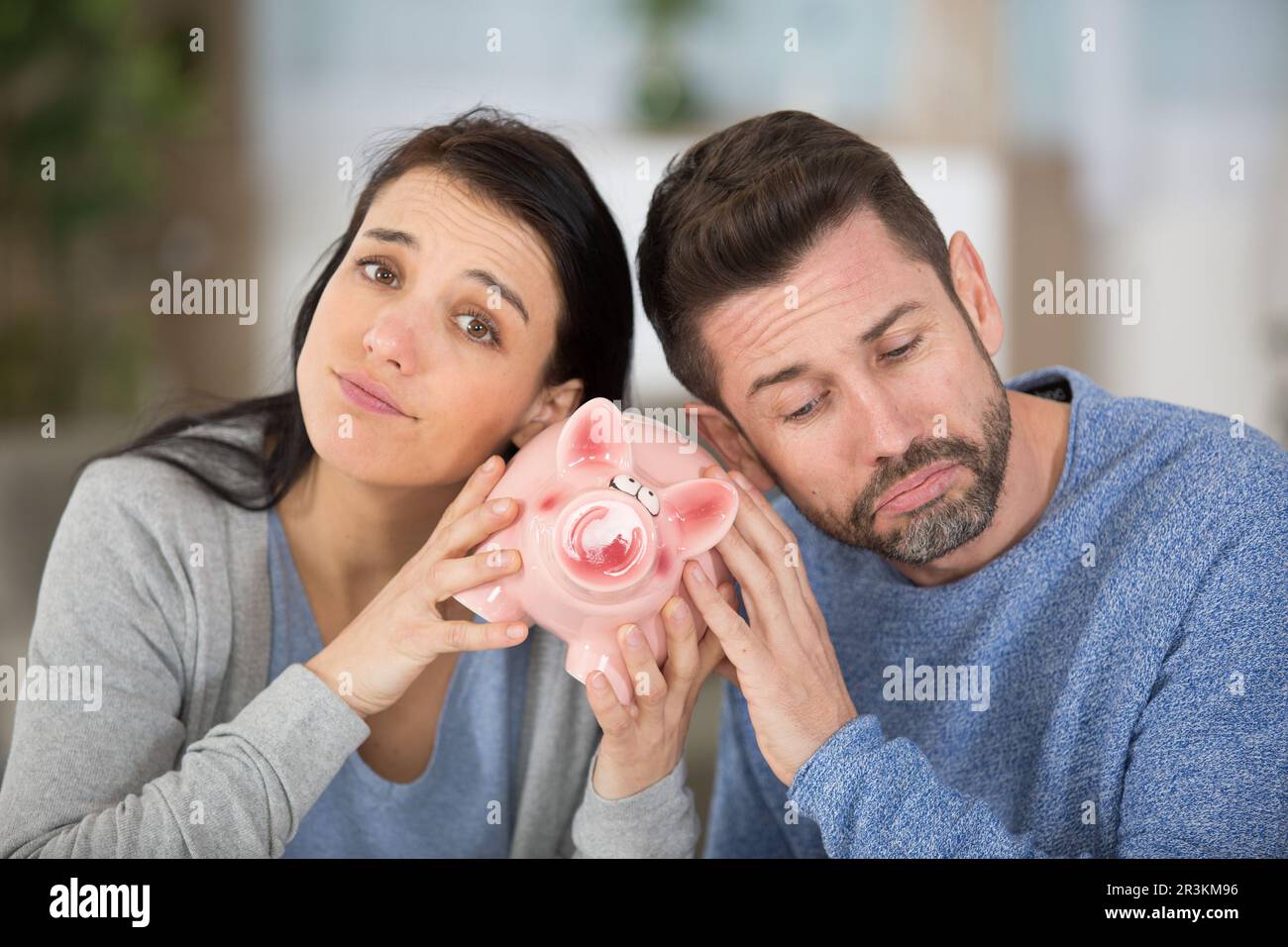 a sad couple in budget planning concept Stock Photo - Alamy