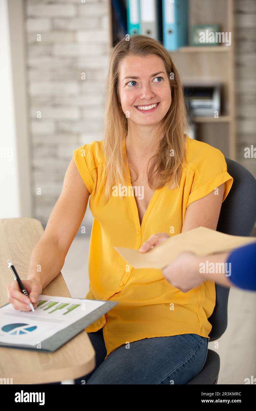happy entrepreneur woman receiving a letter Stock Photo - Alamy
