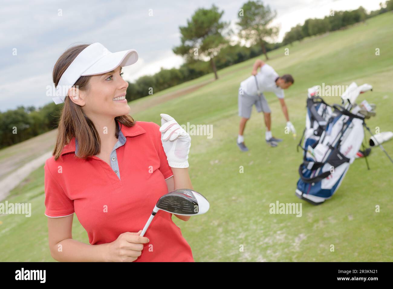 casual happy female golf player Stock Photo - Alamy