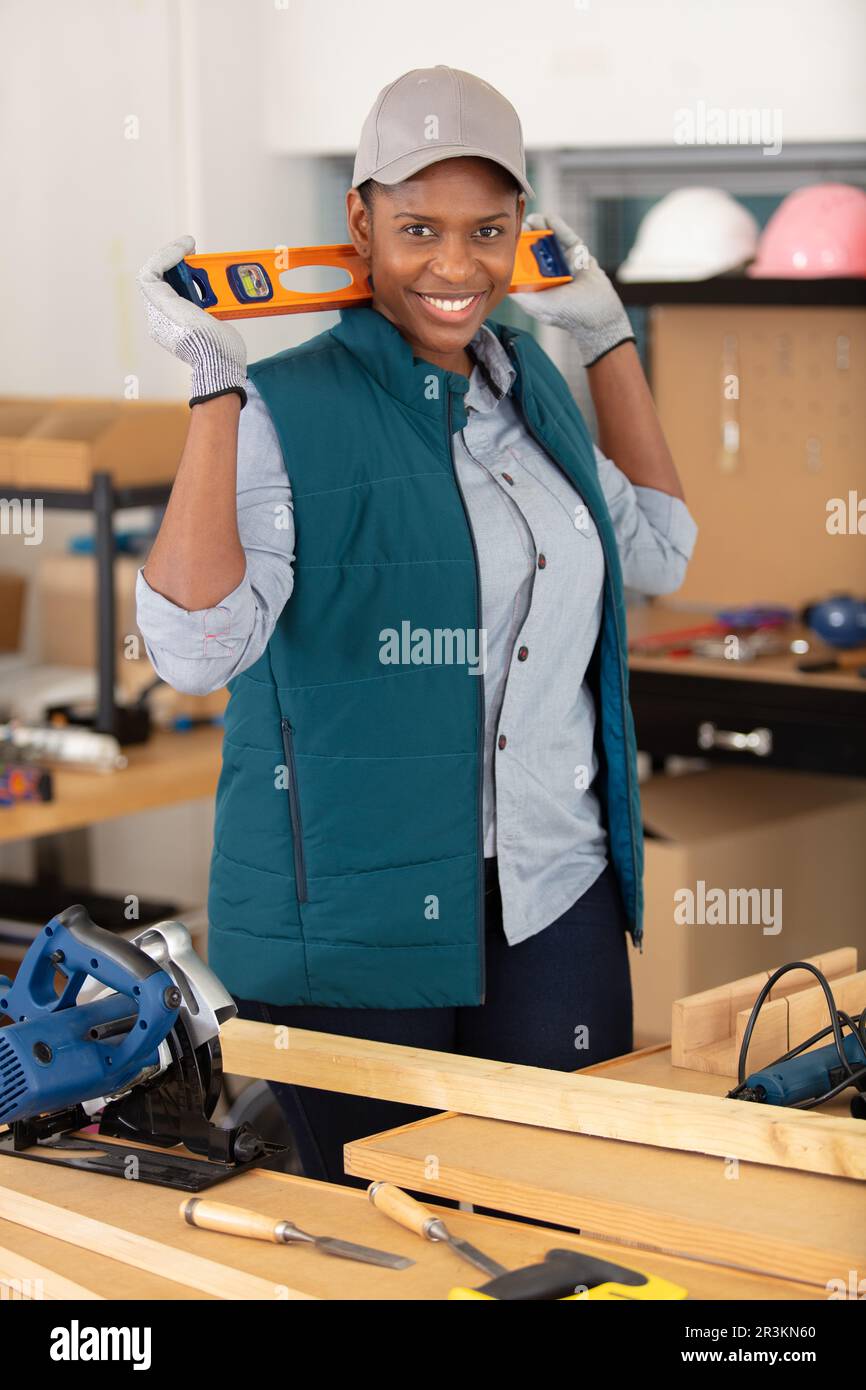 girl-worker hold a ruller with sprit levels Stock Photo - Alamy
