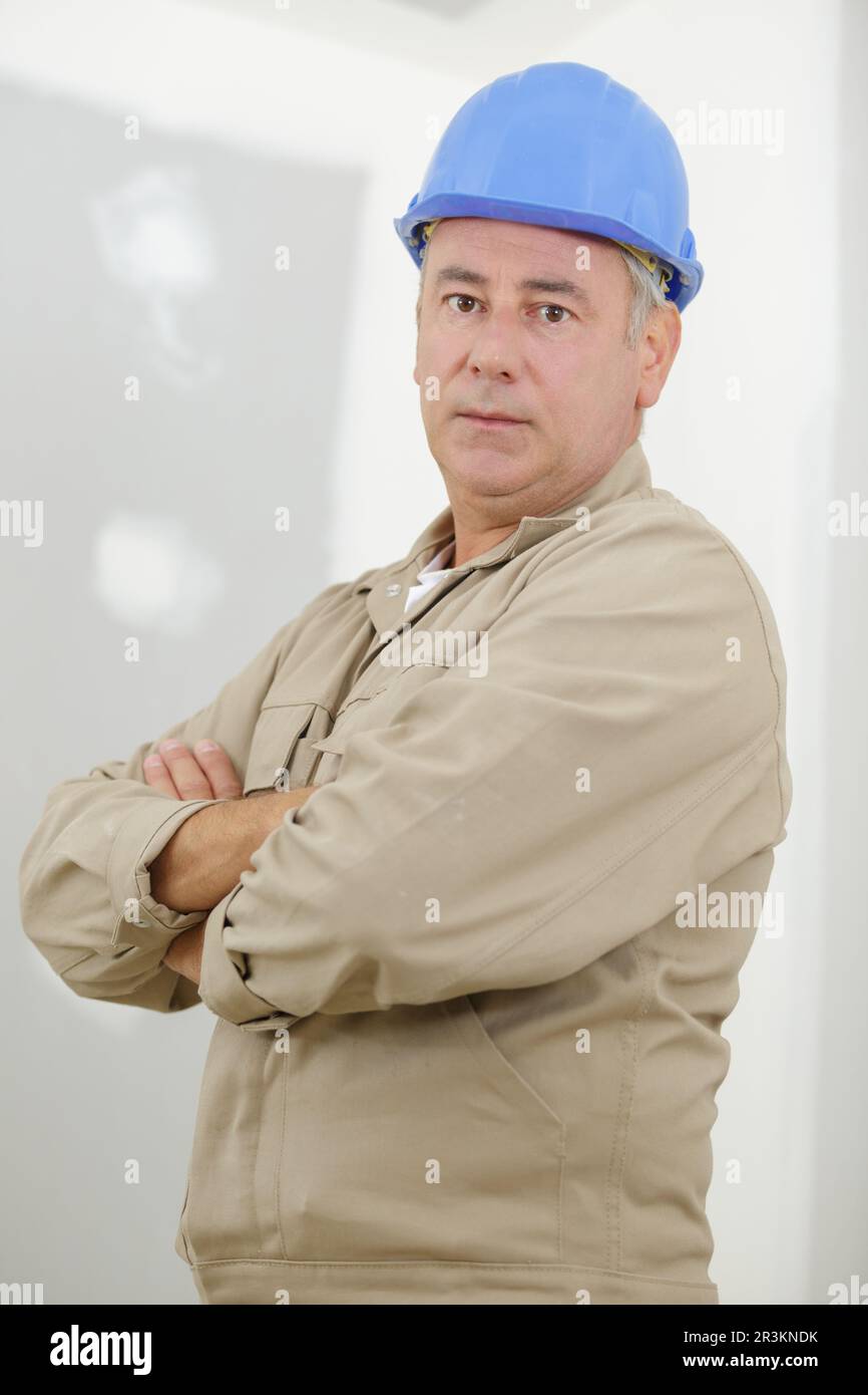 serious builder is looking at camera Stock Photo - Alamy