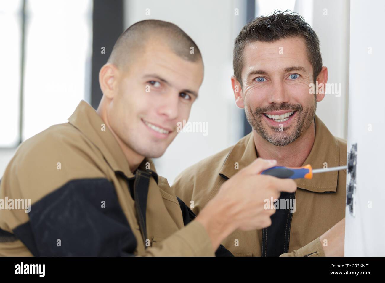 mechanics repairing a socket Stock Photo - Alamy