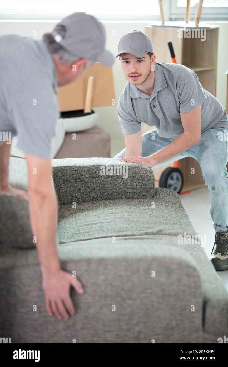 Movers moving sofa hi-res stock photography and images - Alamy