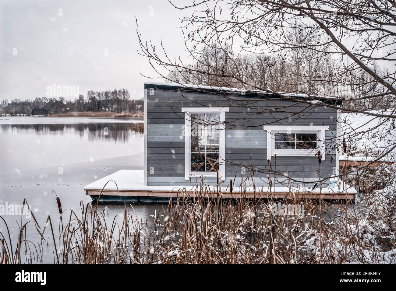 Floating grey cabin on the freezing lake Stock Photo - Alamy