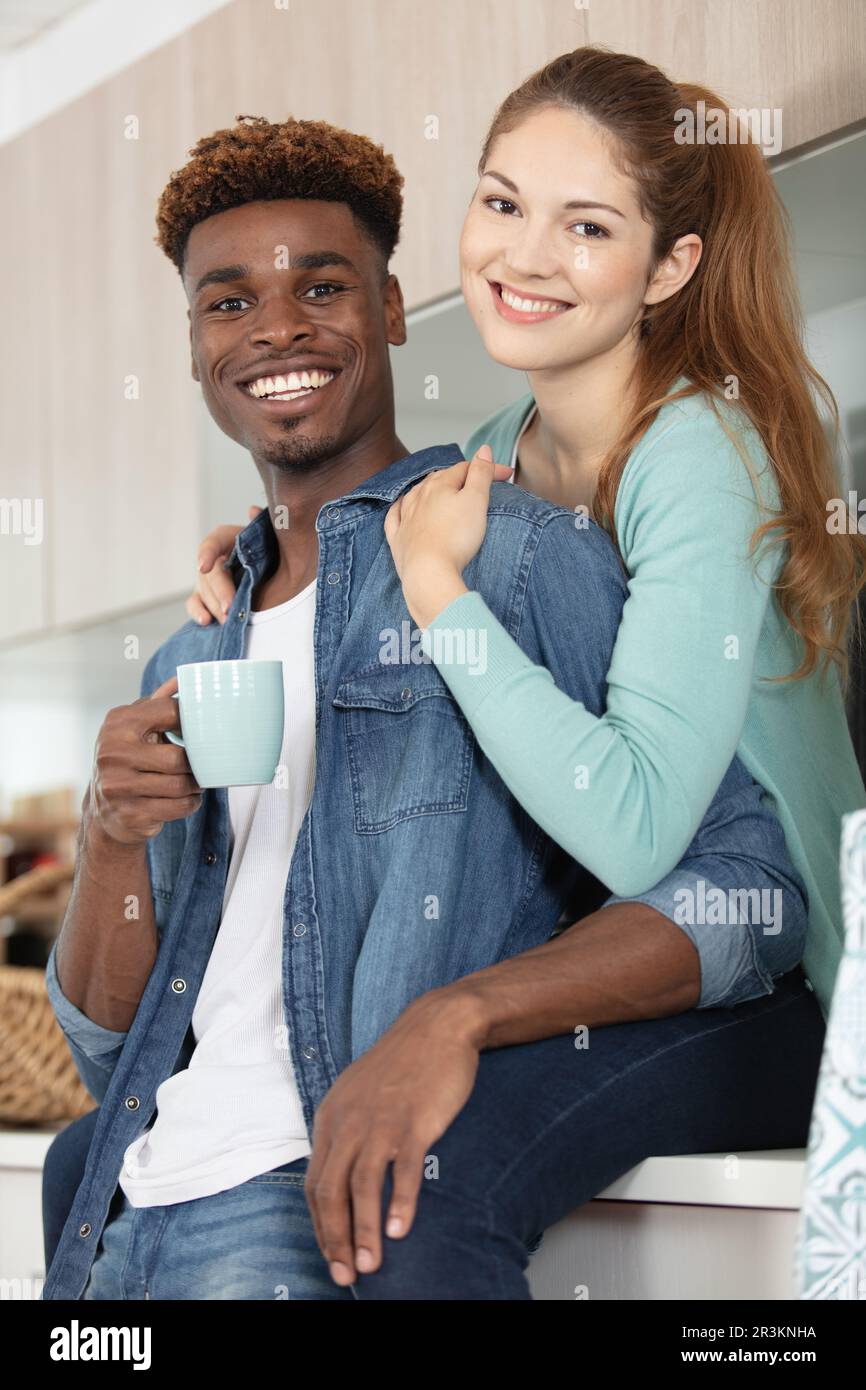 couple in love hugging and drinking coffee Stock Photo - Alamy