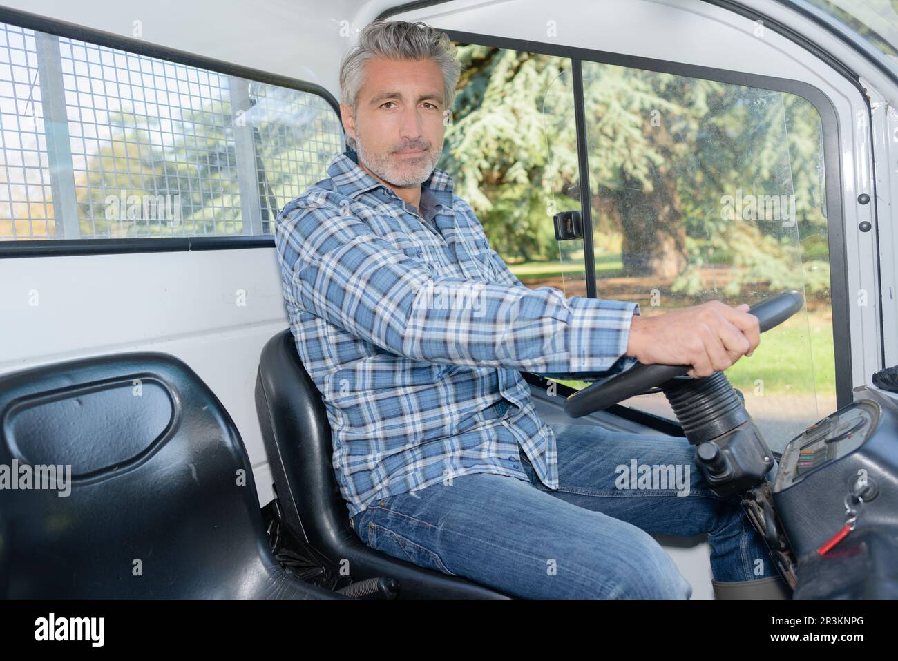 Postal worker driving truck hi-res stock photography and images - Alamy